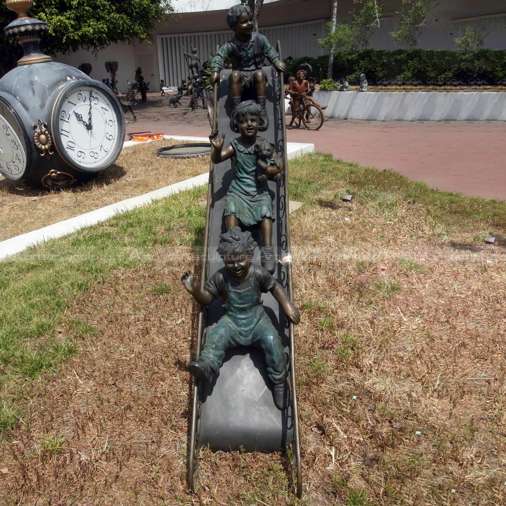 Children On Slide Bronze Statue